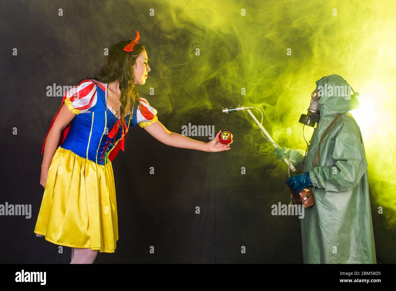 Woman holding hazardous radioactive apple. Nuclear and radiation ...