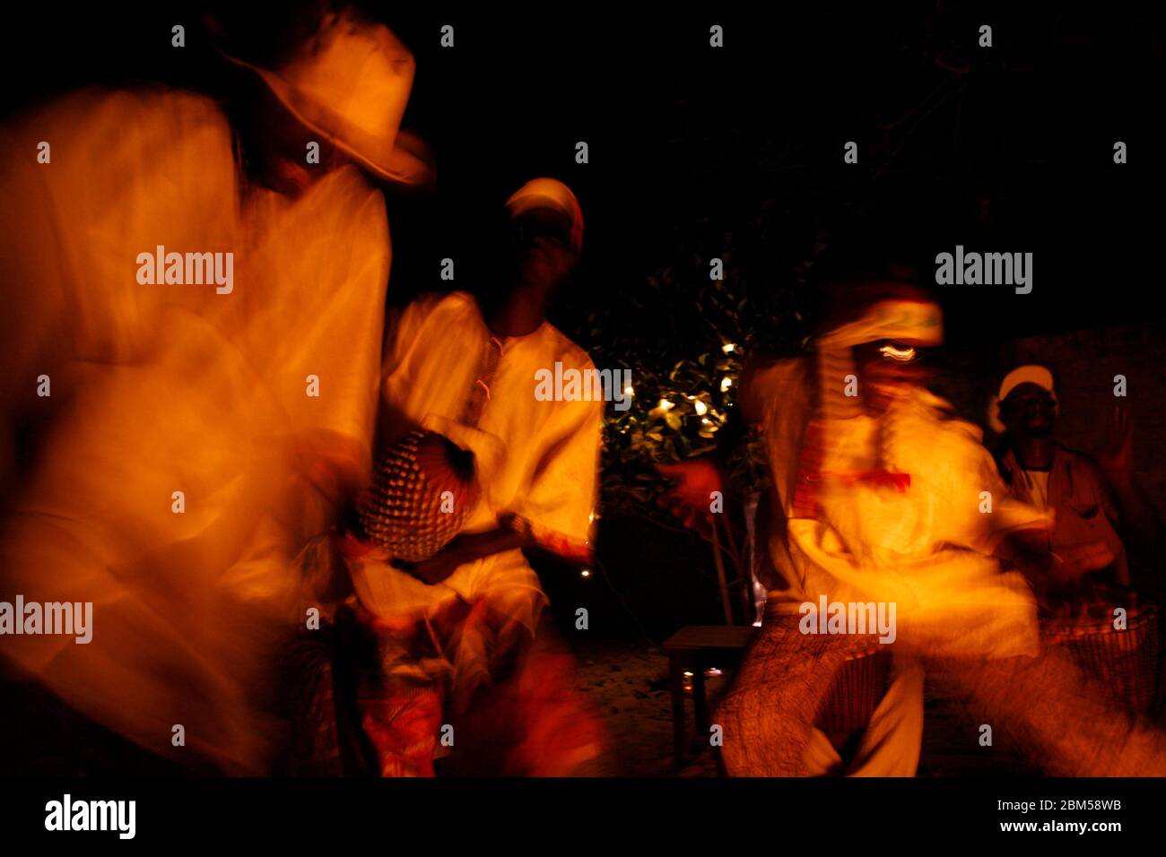 Gunjur staff member dancing to the resident drummers, 'The Tribal Stars ...