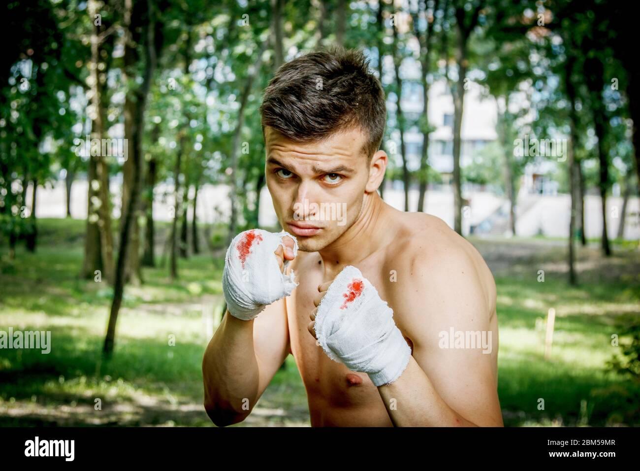 aggressive boxer diligently trains hands in blood Stock Photo - Alamy