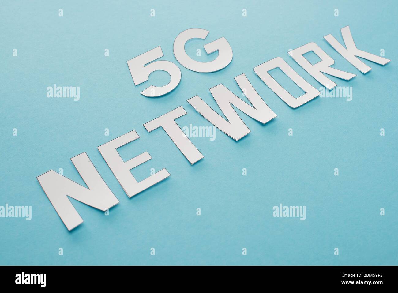 white 5g network lettering on blue background Stock Photo - Alamy