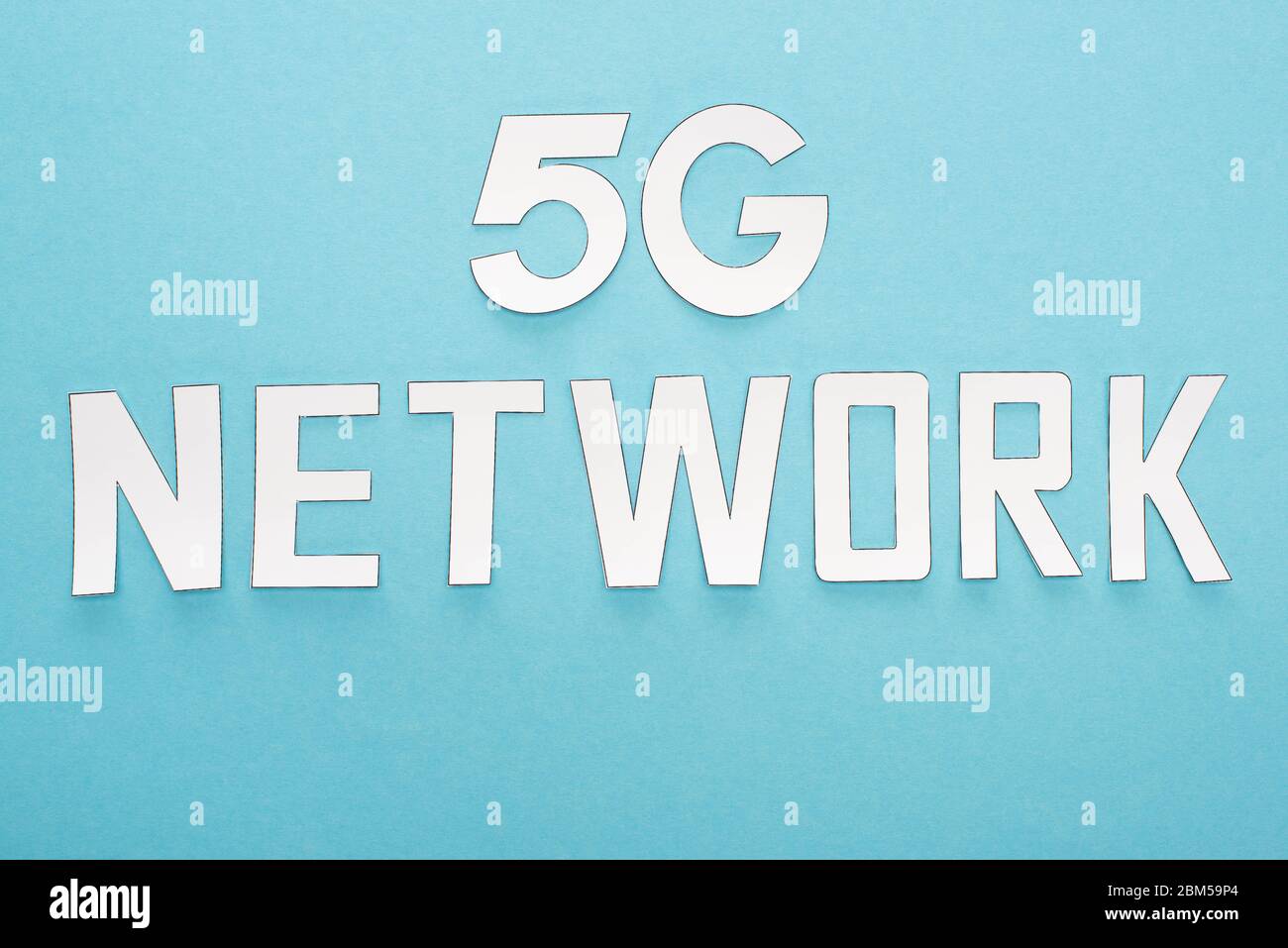 top view of white 5g network lettering on blue background Stock Photo ...