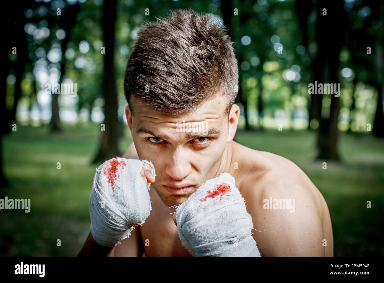 aggressive boxer diligently trains hands in blood Stock Photo - Alamy