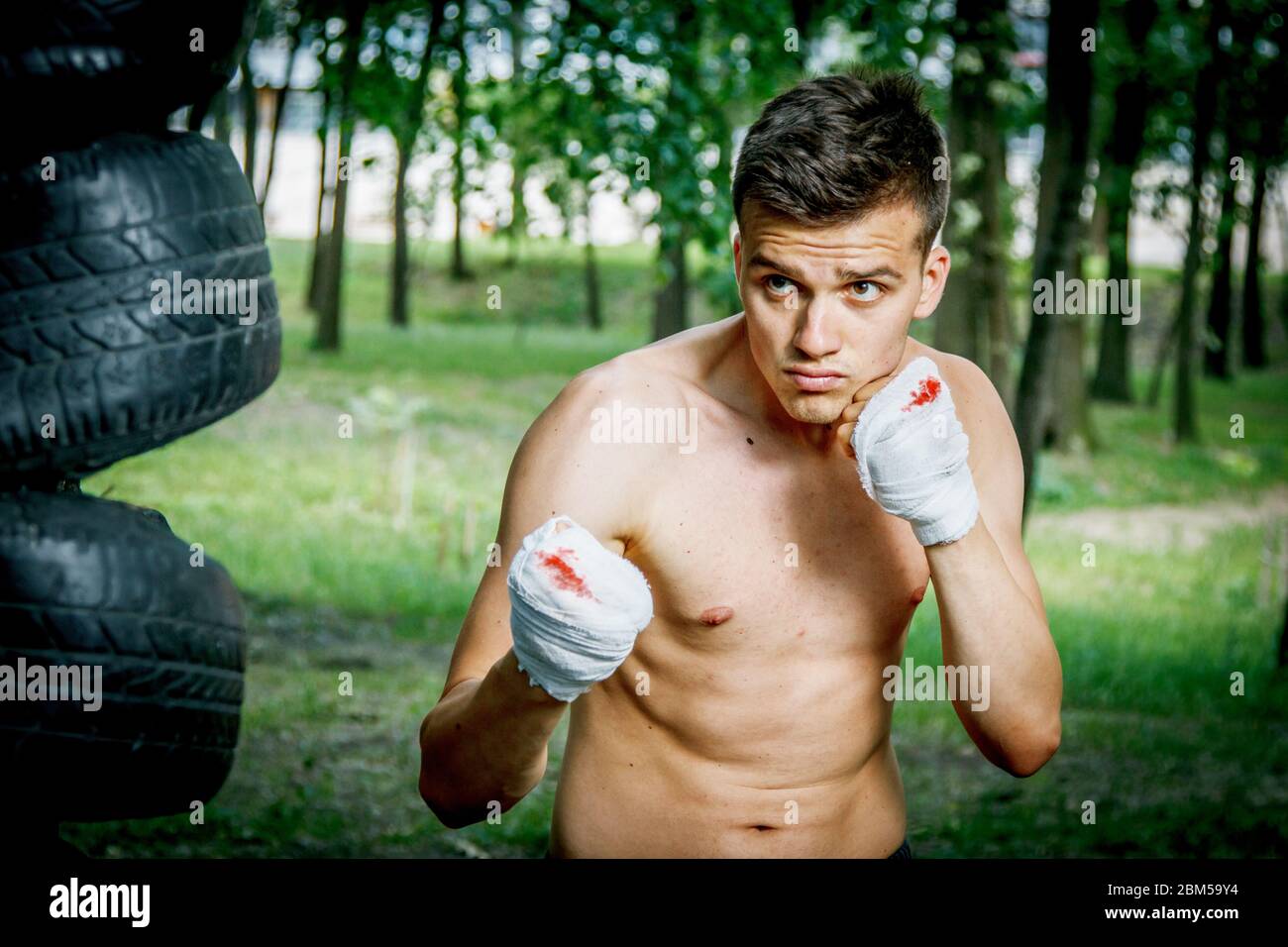 aggressive boxer diligently trains hands in blood Stock Photo - Alamy