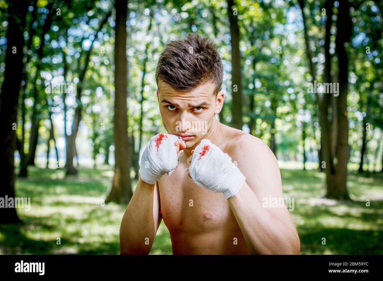 aggressive boxer diligently trains hands in blood Stock Photo - Alamy