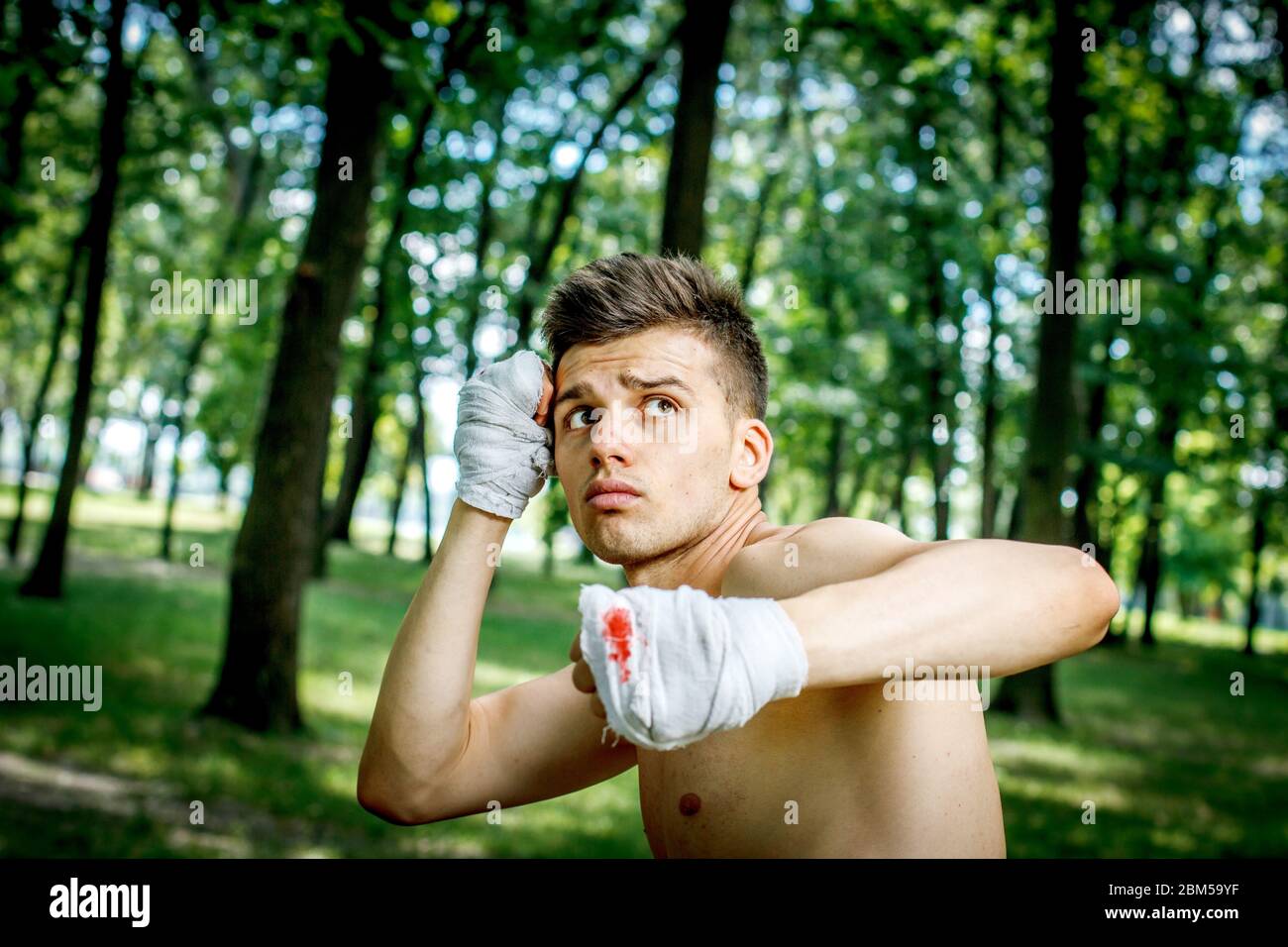 aggressive boxer diligently trains hands in blood Stock Photo - Alamy