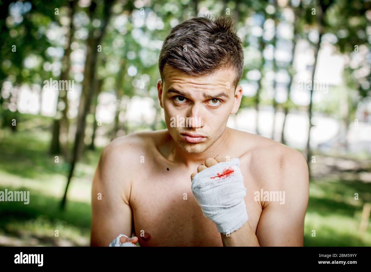 aggressive boxer diligently trains hands in blood Stock Photo - Alamy