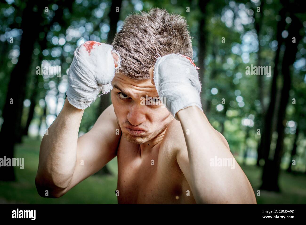 aggressive boxer diligently trains hands in blood Stock Photo - Alamy