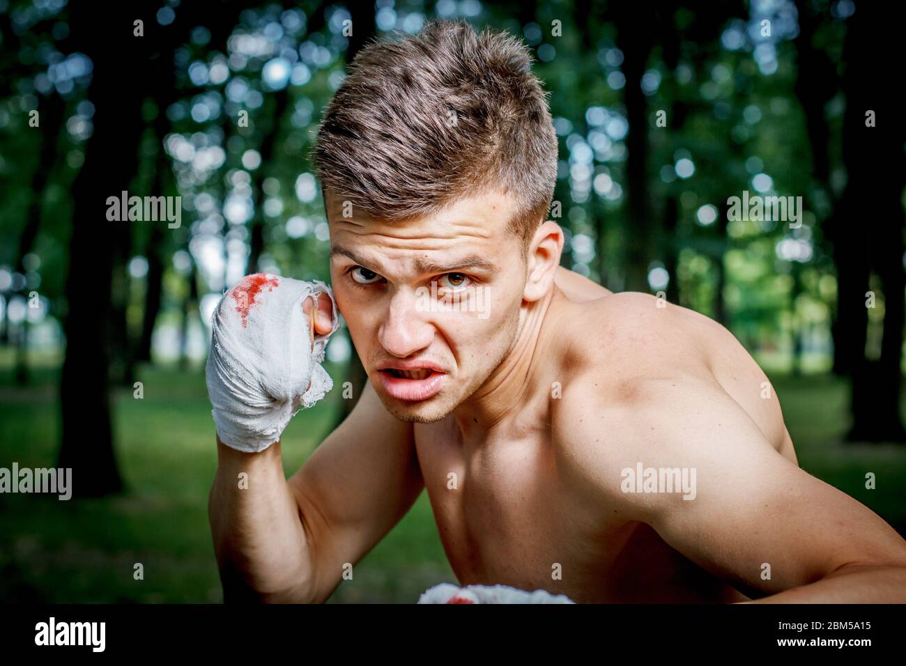 aggressive boxer diligently trains hands in blood Stock Photo - Alamy