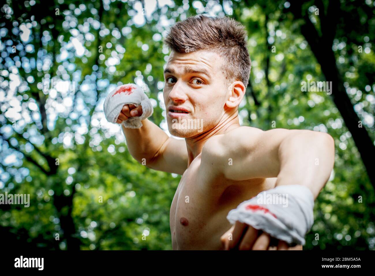 aggressive boxer diligently trains hands in blood Stock Photo - Alamy