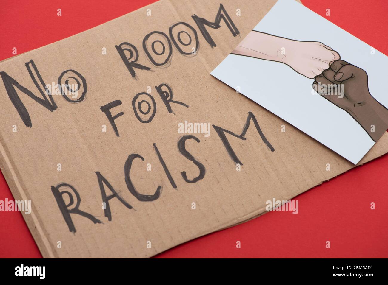 carton placard with say no room for racism lettering and picture with ...