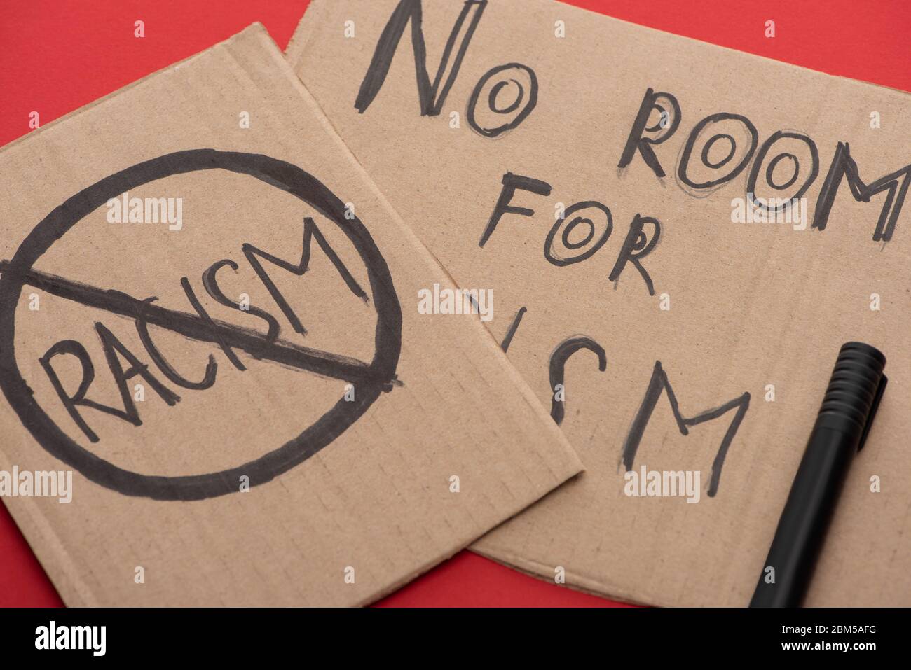 carton placards with stop racism lettering on red background Stock ...