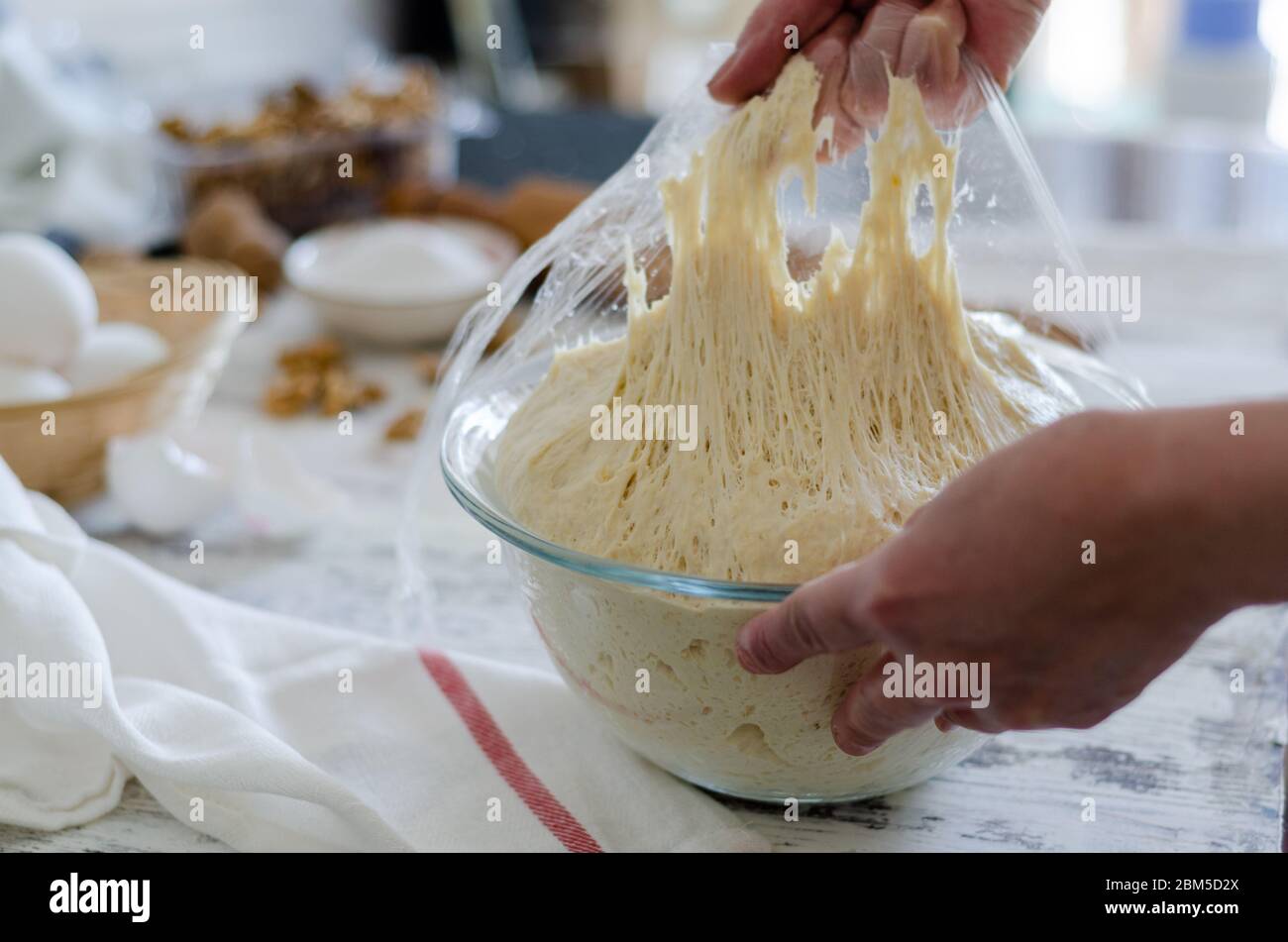 Process of preparing dough for bread in the kitchen Stock Photo - Alamy