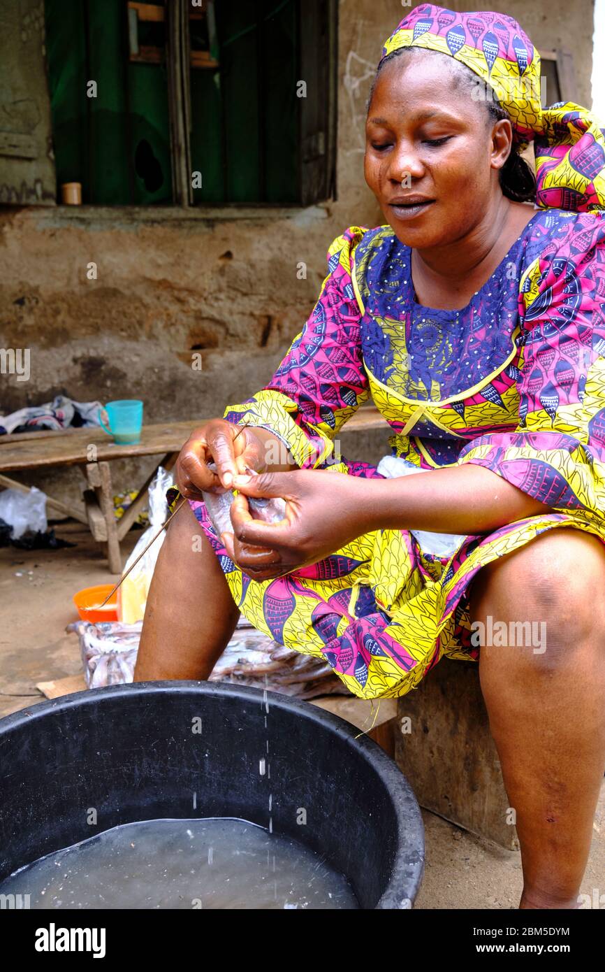 Woman cleaning fish hi-res stock photography and images - Alamy