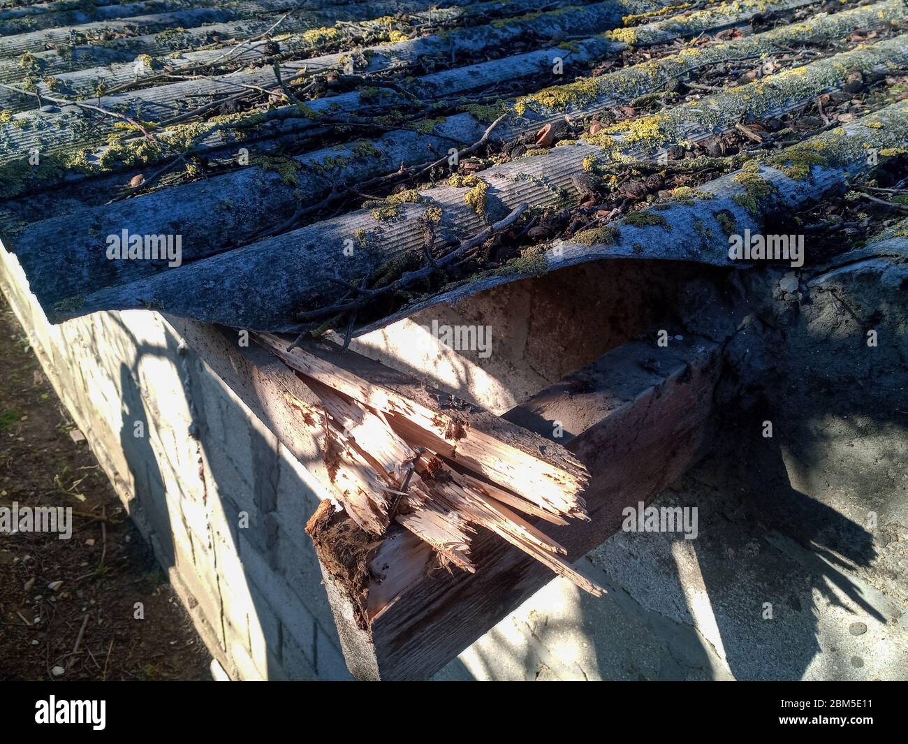Broken roof of the barn. Broken slate and broken rafters Stock Photo ...