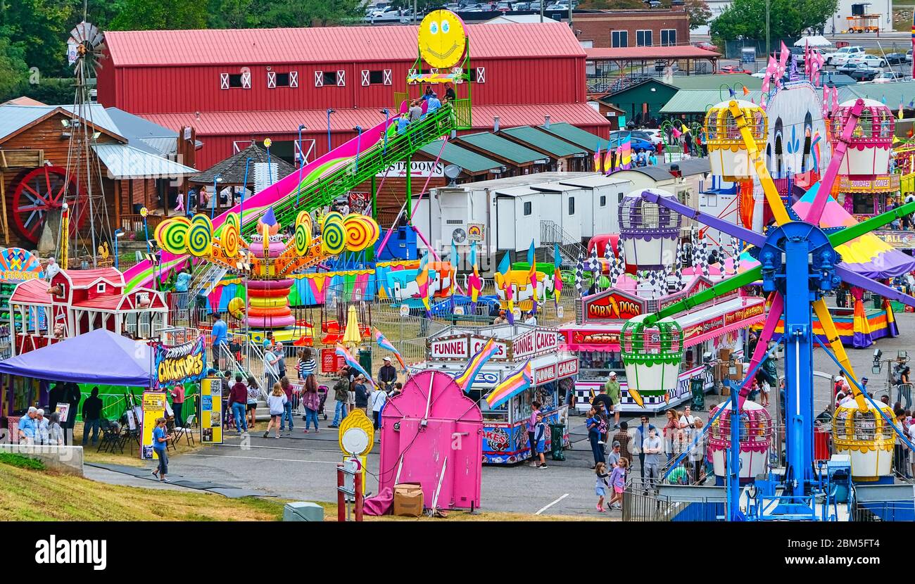 Food Vendors and Rides at Carnival Stock Photo - Alamy