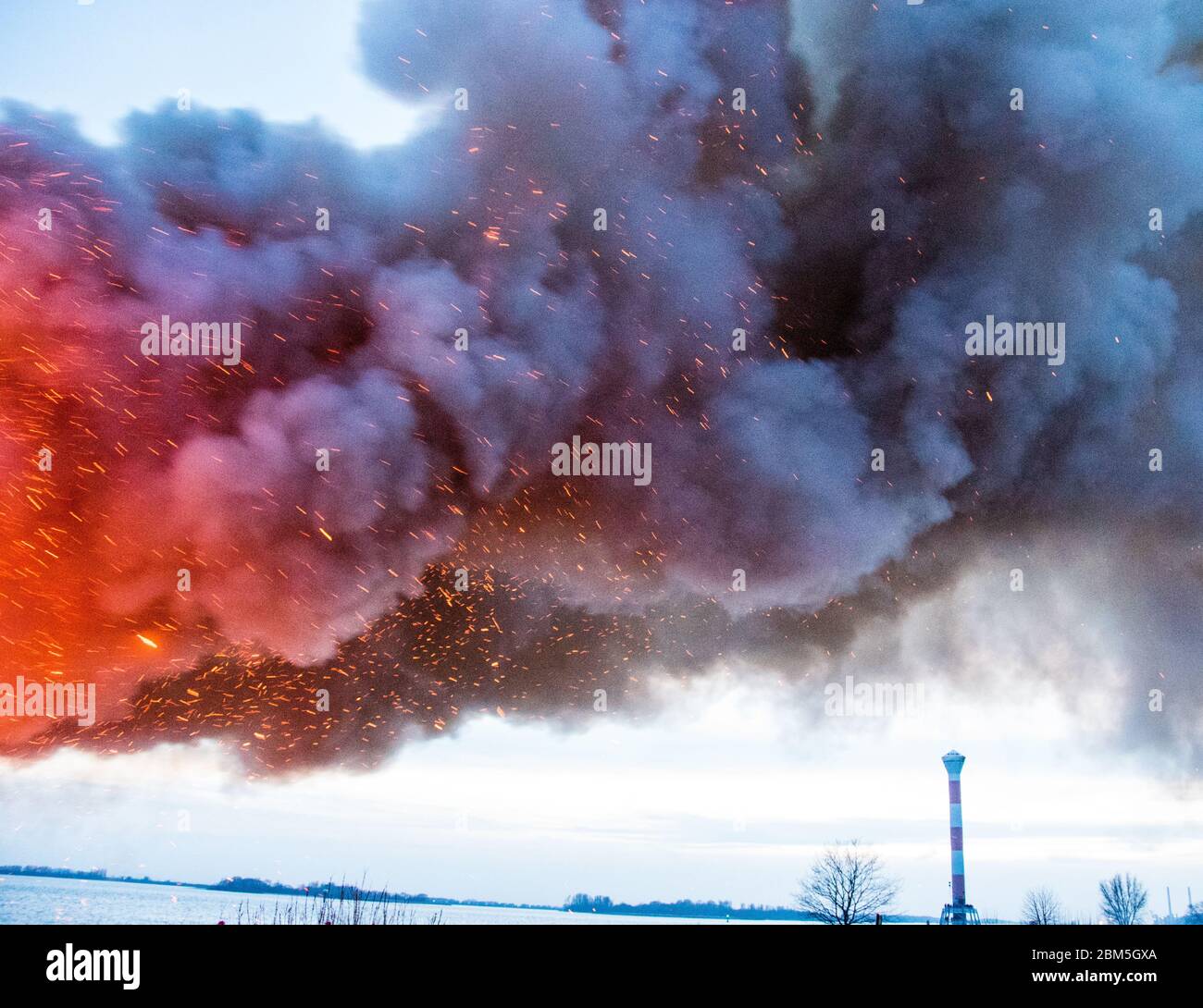 smoke from fire in front of lighthouse Stock Photo - Alamy