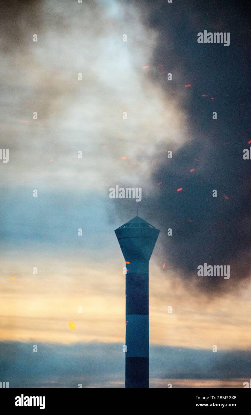 smoke from fire in front of lighthouse Stock Photo - Alamy