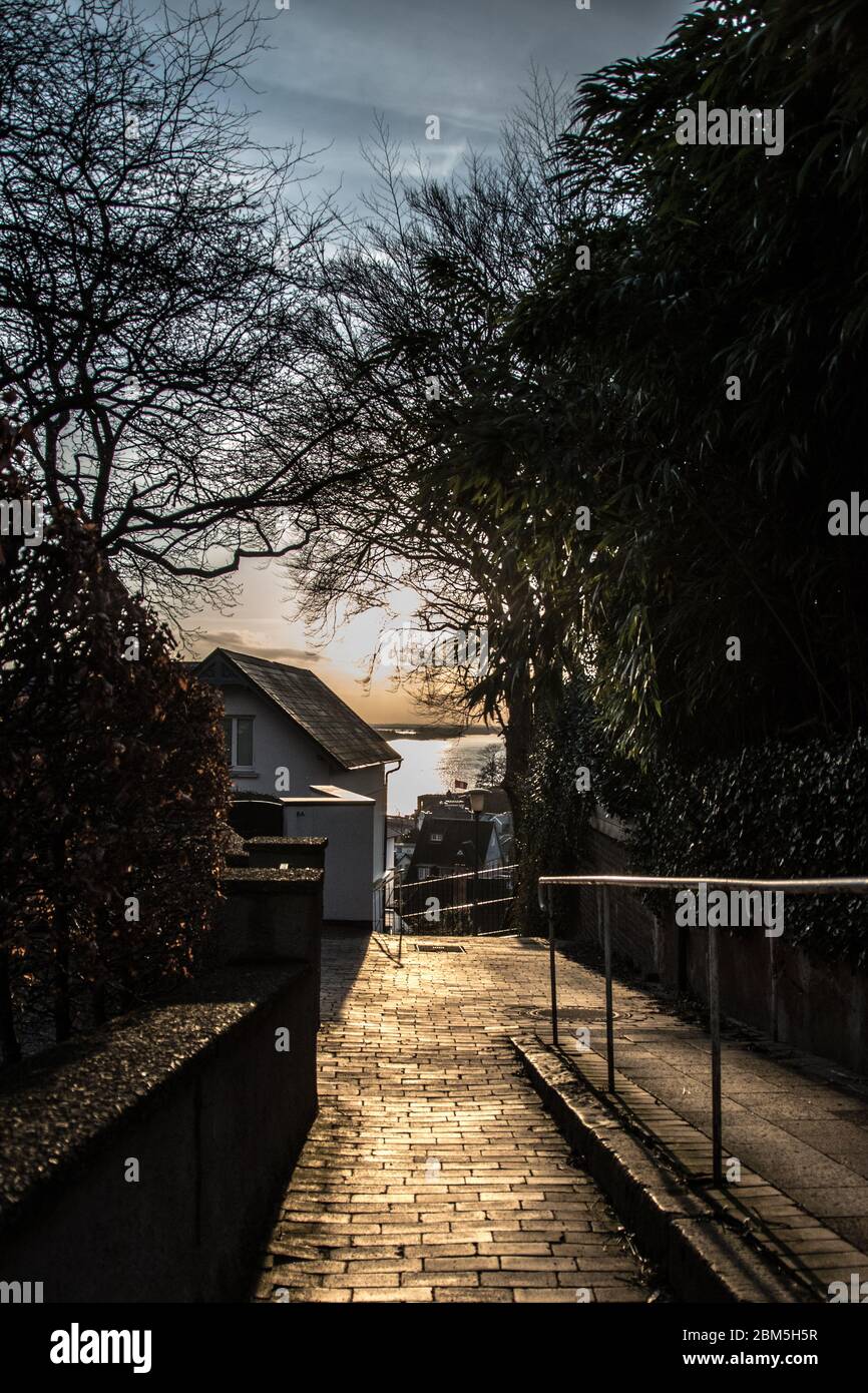 sunset view in a small town over the river Stock Photo - Alamy