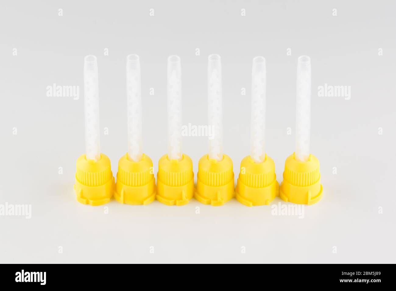 Cannula for mixing dental impression masses isolated on white ...