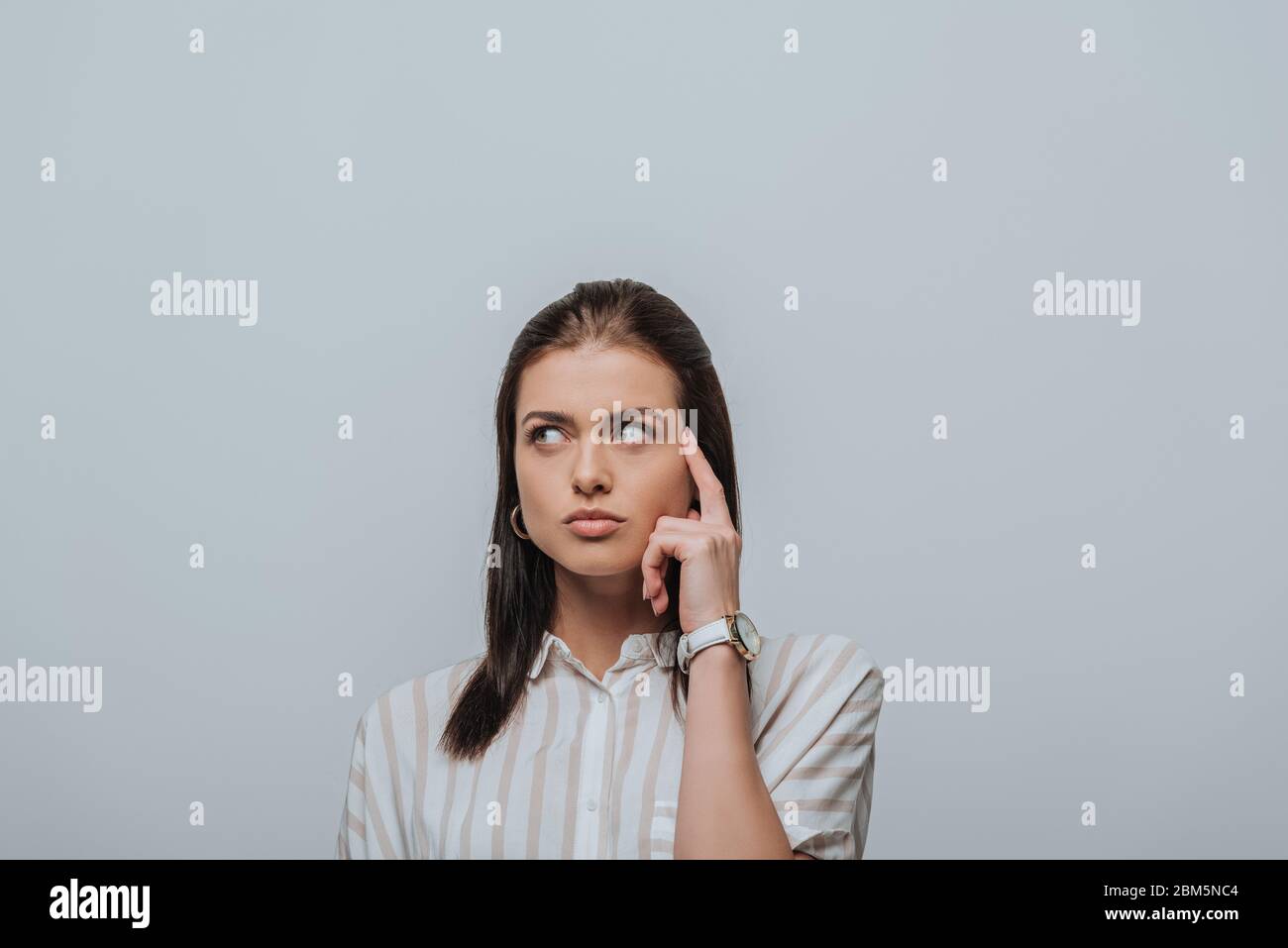 Finger at forehead hi-res stock photography and images - Alamy