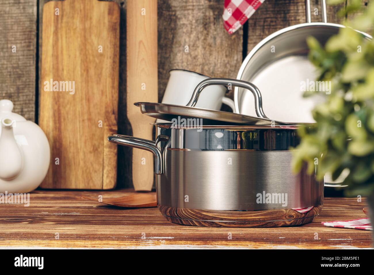 Set of cookware utensils on a kitchen counter Stock Photo - Alamy