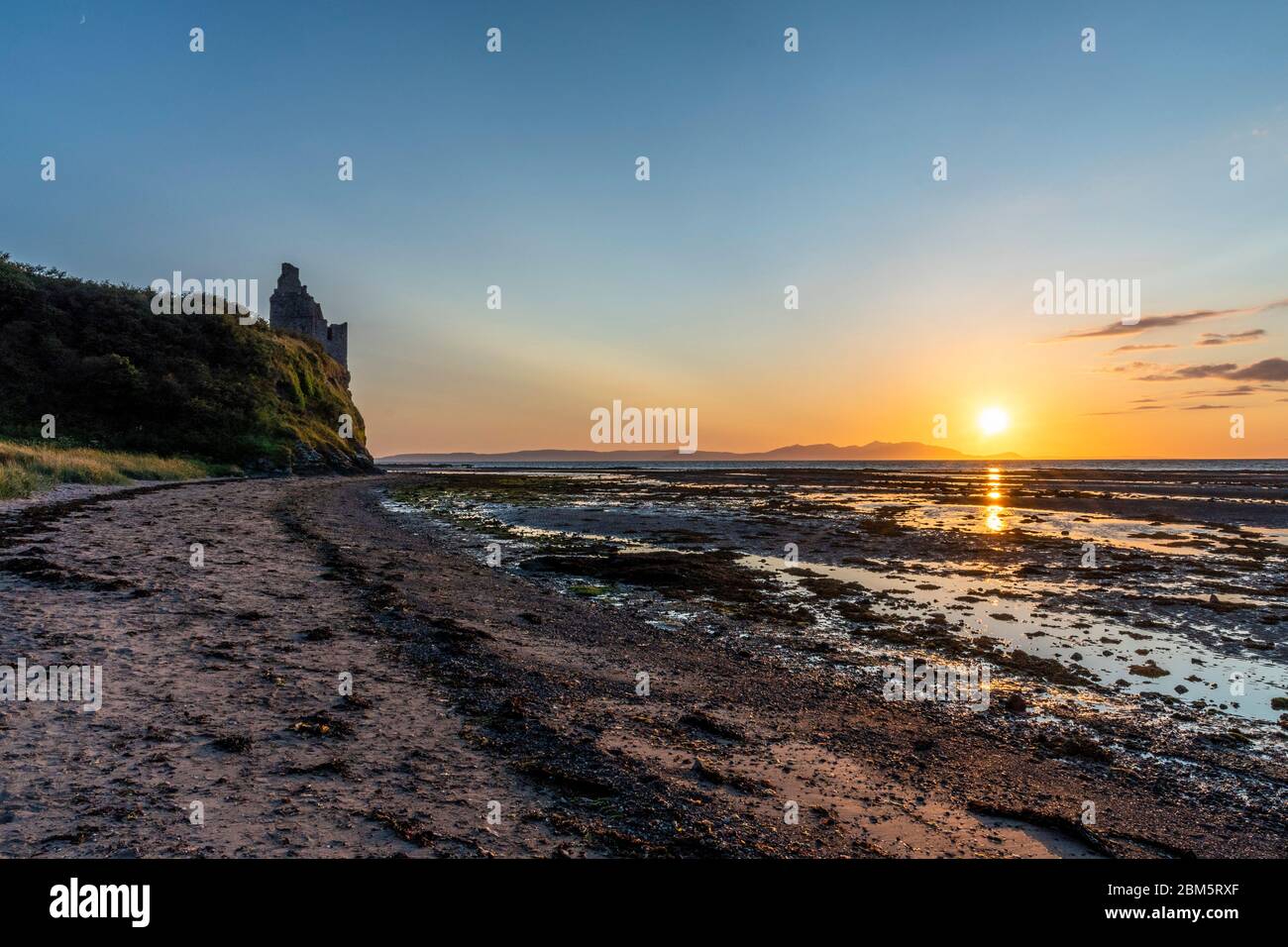 Arran sunset from beach at Greenan Castle, Heads of Ayr Stock Photo - Alamy