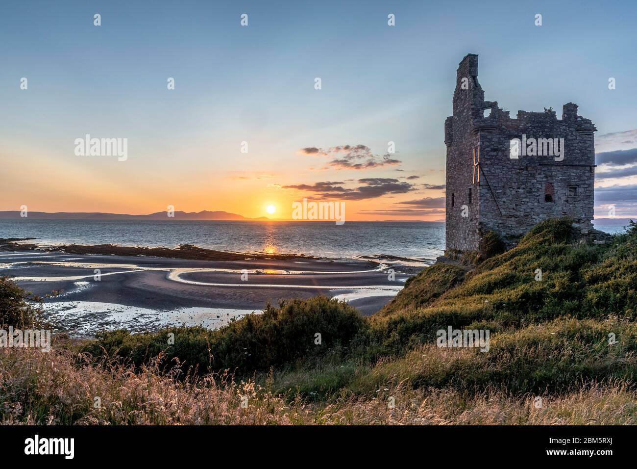 Arran sunset from beach at Greenan Castle, Heads of Ayr Stock Photo - Alamy