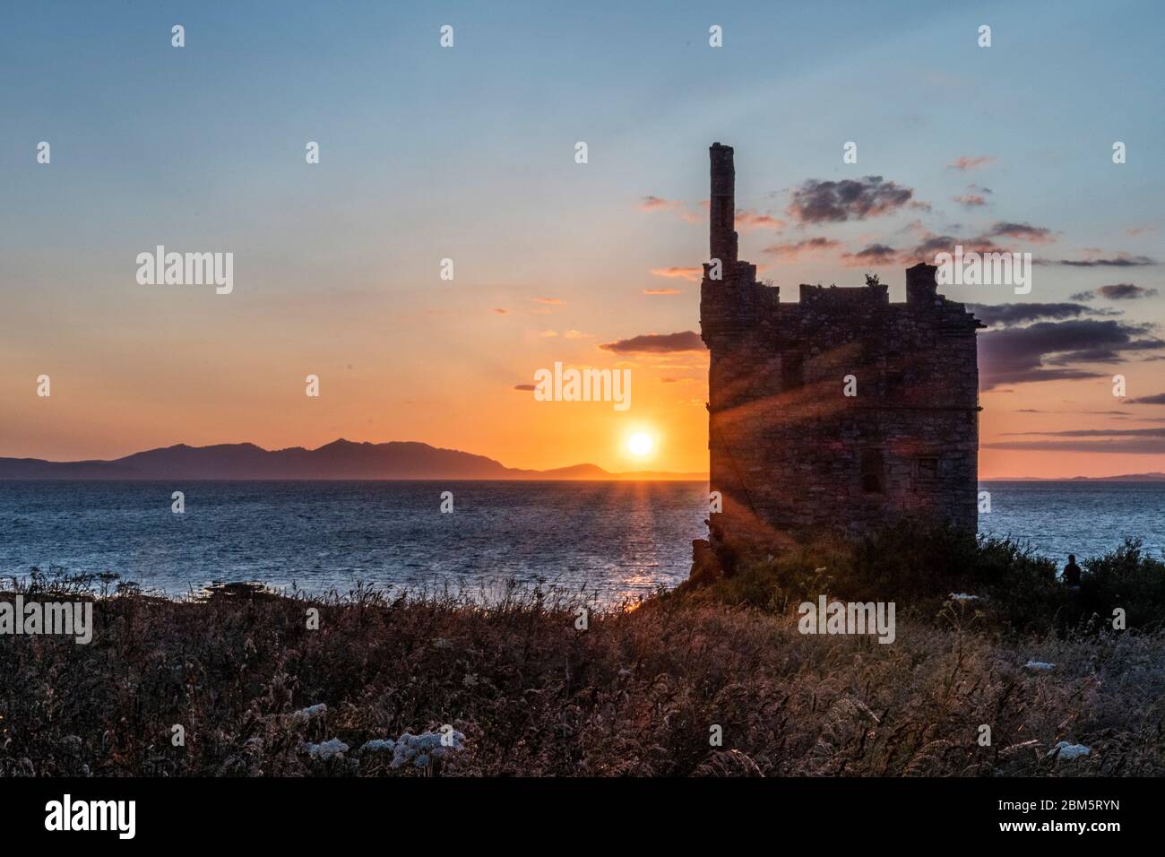 Arran sunset from beach at Greenan Castle, Heads of Ayr Stock Photo - Alamy