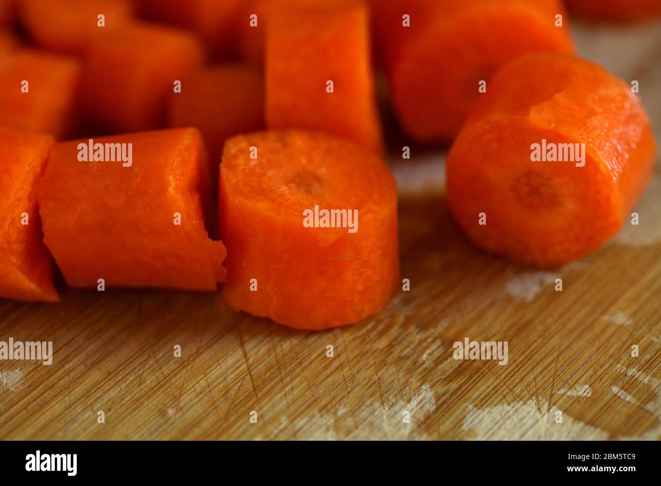 Carrot cut in slices on a board Stock Photo - Alamy