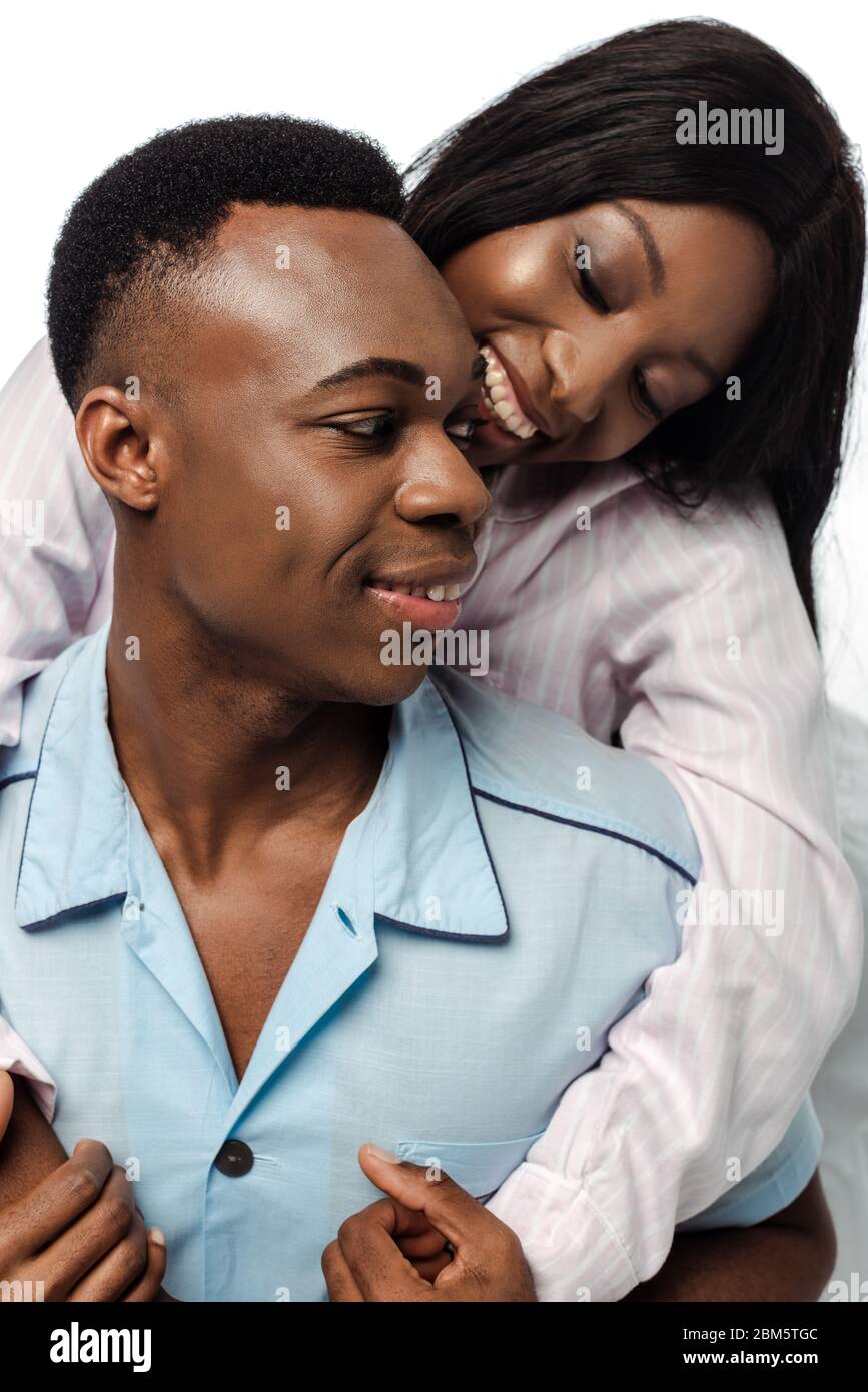 happy african american couple hugging in pajamas isolated on white ...