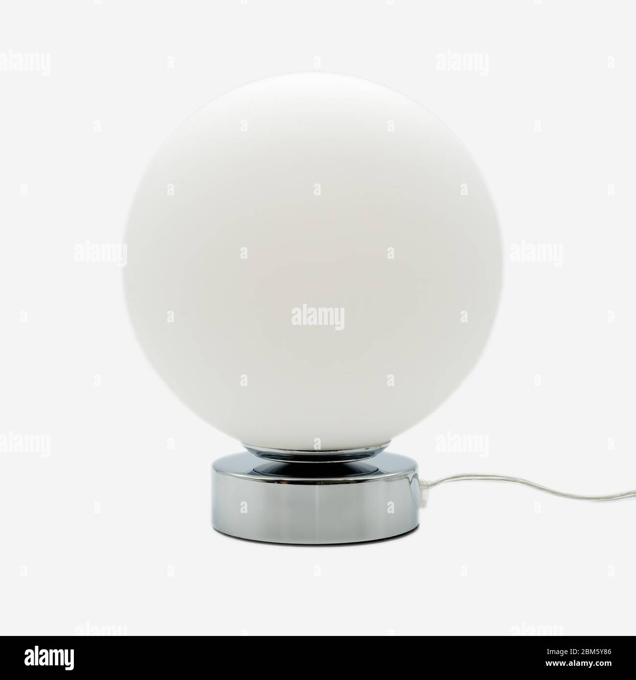 A white matt glass ball lamp with a chrome-colored base, cut out on ...