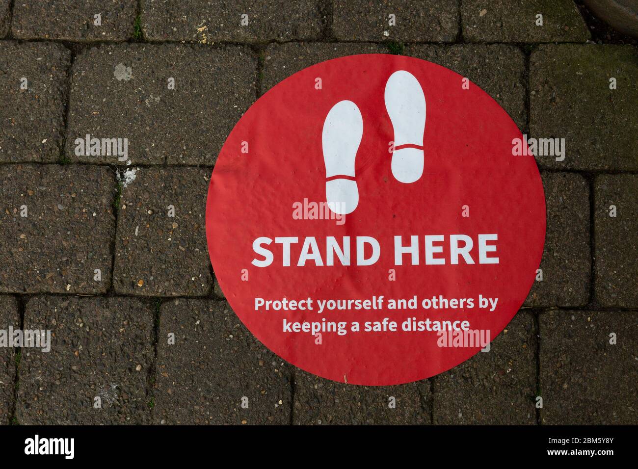 A sticker on the pavement outside a building society / bank shows ...