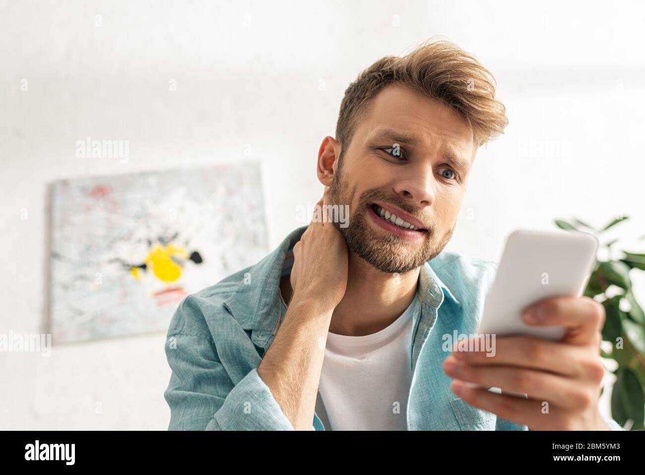 Confused man in room hi-res stock photography and images - Alamy