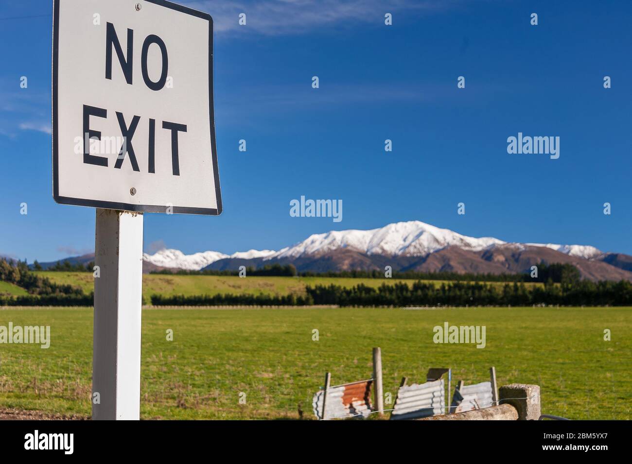A white painted 'No Exit' sign warns motorists of a no through road ...