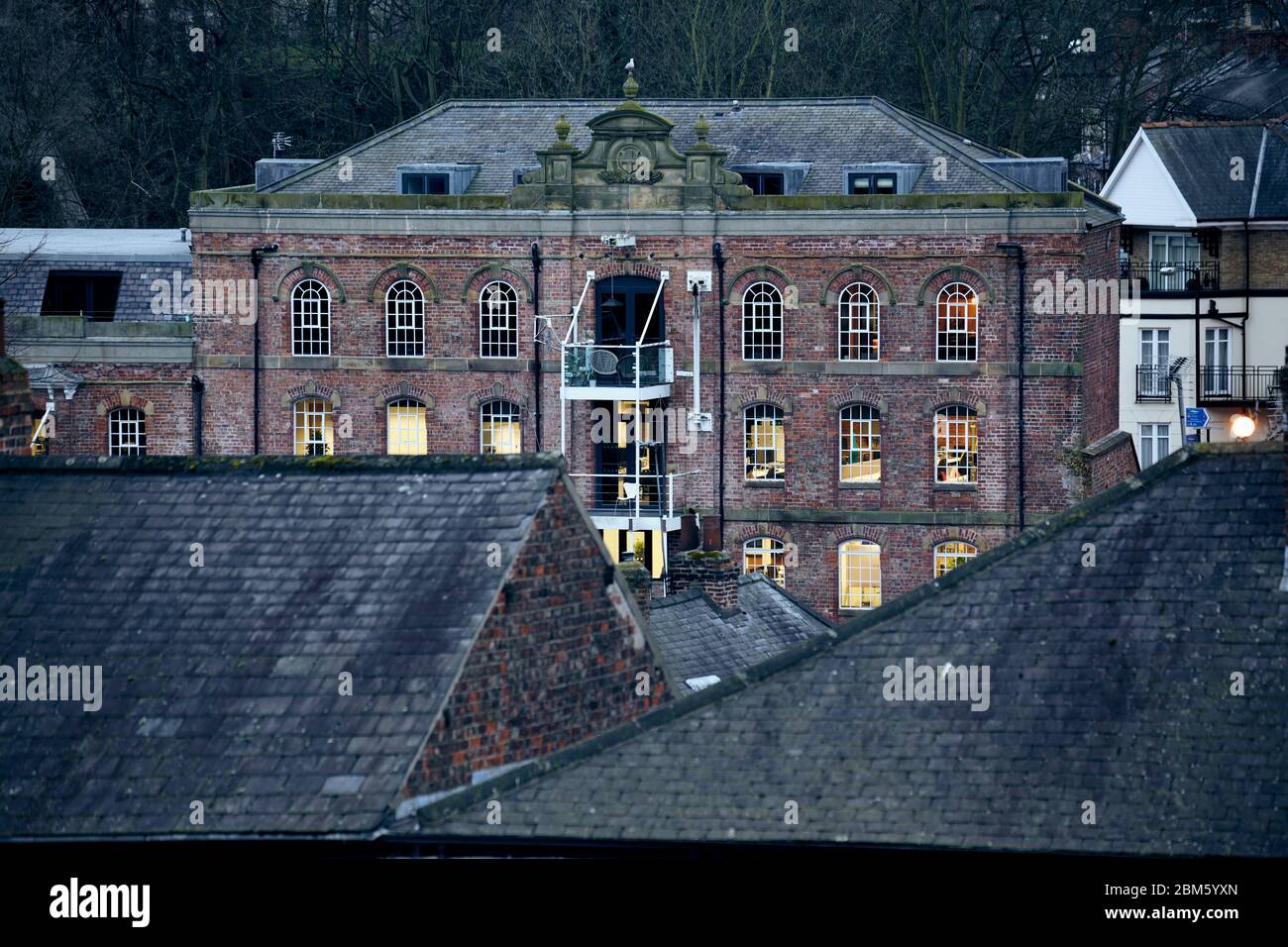 Old storage building converted into offices on the river Ouse, York ...