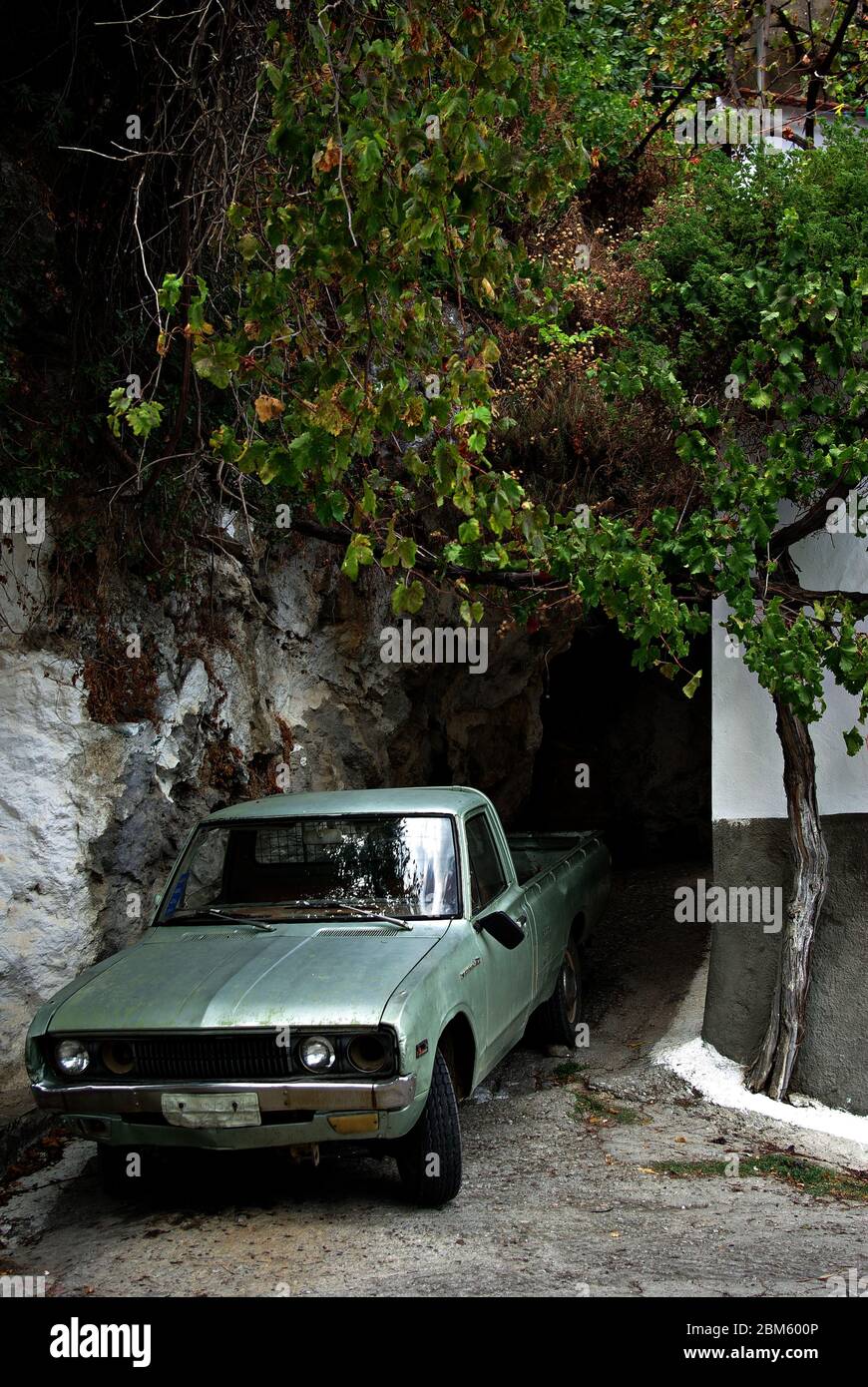 Rusty abandoned and neglected car parked on a city street Stock Photo ...