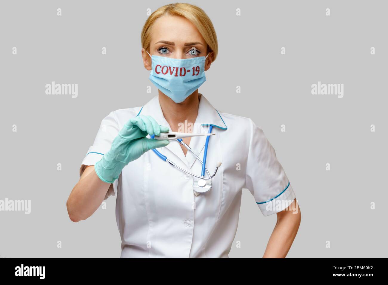 medical doctor nurse woman wearing protective mask and rubber or latex ...