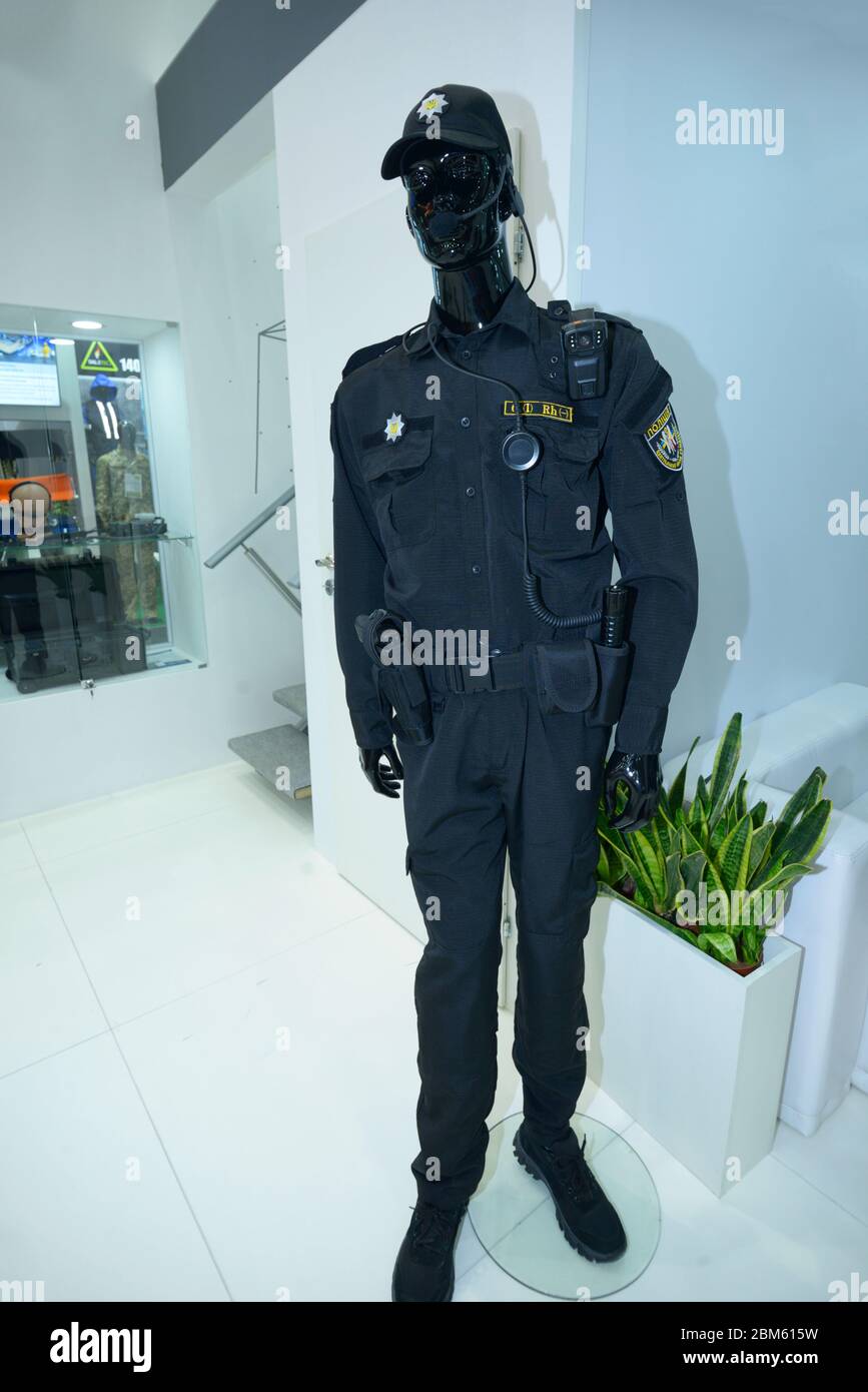 New uniform and equipment of Ukrainian police officer, handgun in a ...