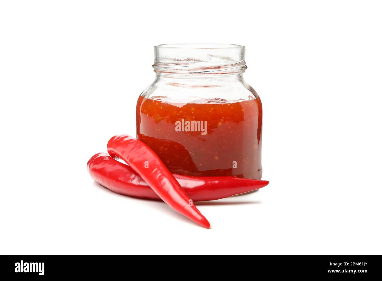 Chilli pepper and glass jar of sauce isolated on white background Stock ...