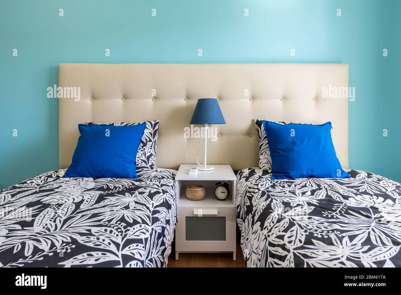 Modern bedroom in white and blue colors. European hotel design and ...
