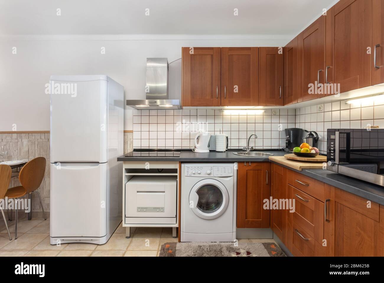 Modern white kitchen with electrical accessories. European design Stock ...