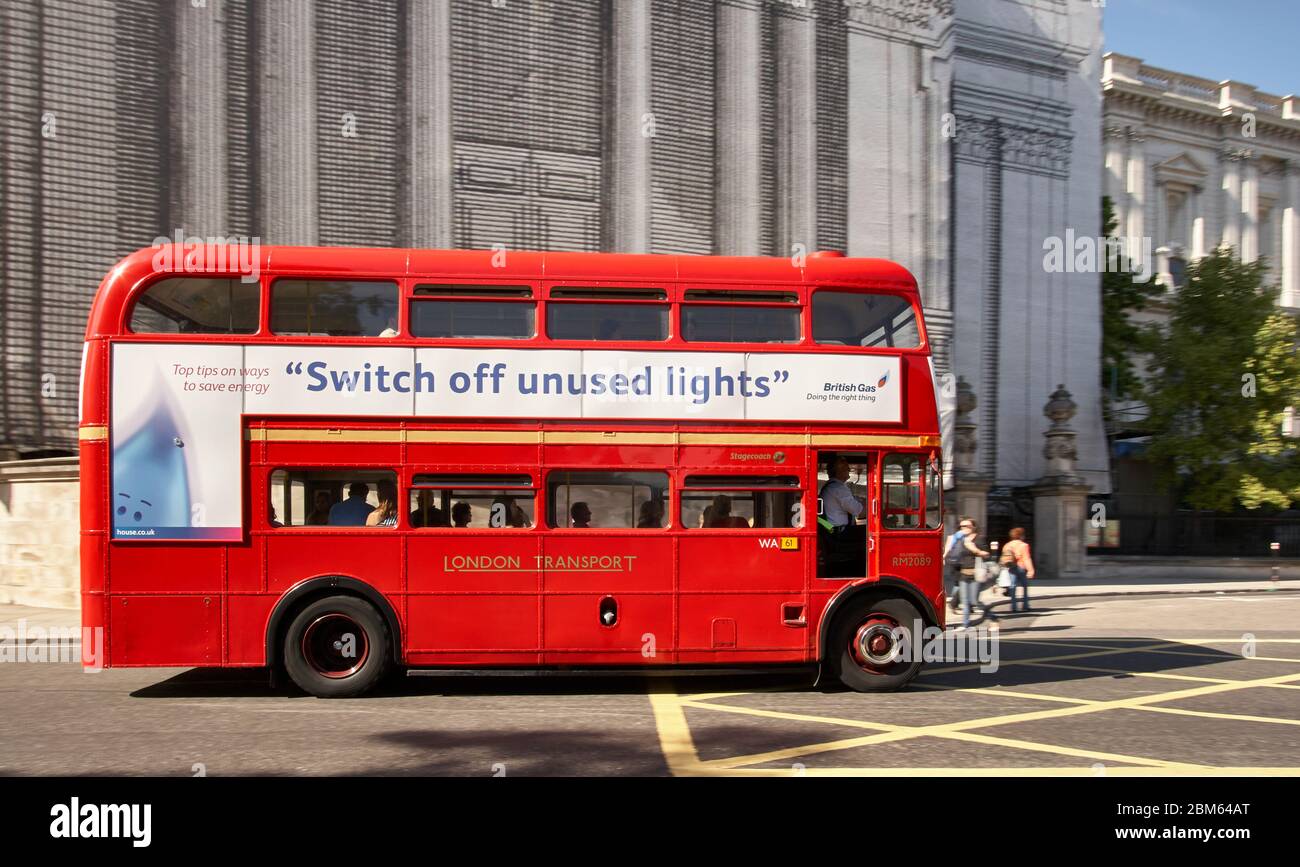 Iconic red London Routemaster bus with 'Switch off unused lights ...