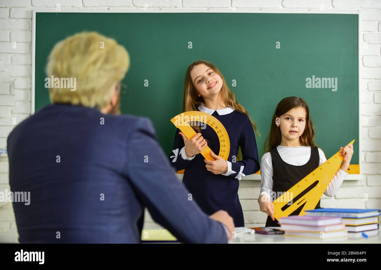 Study together. Teacher and kids Classroom. Discussion group of ...