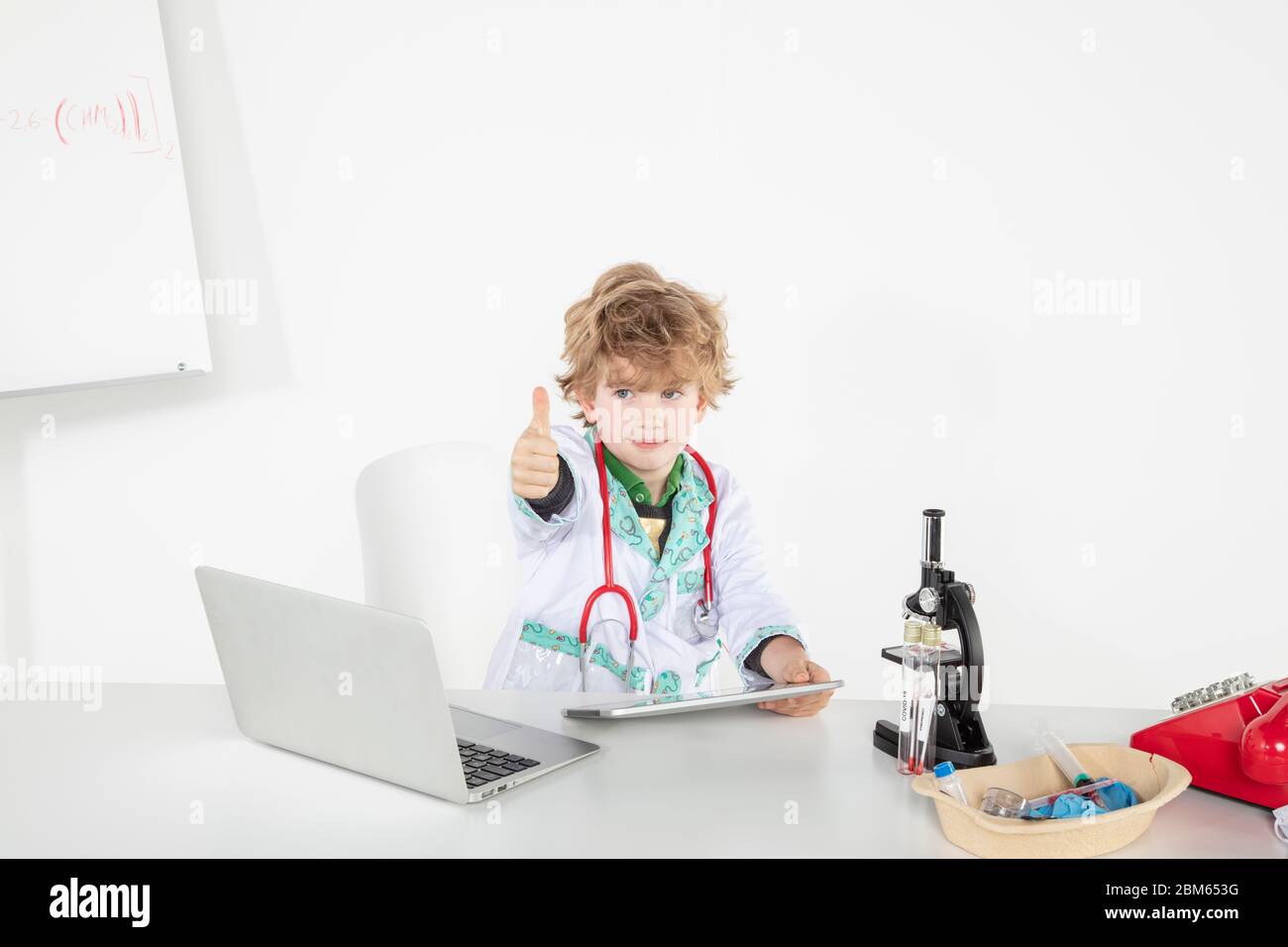 busy young doctor shows thumbs up, a symbol of good luck Stock Photo ...