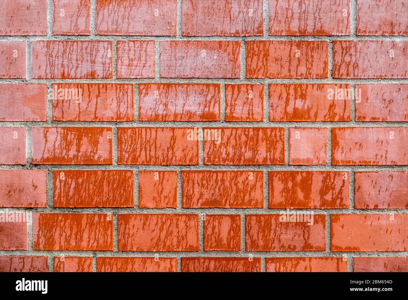 Close up view at an aged and weathered red brick wall at historical ...