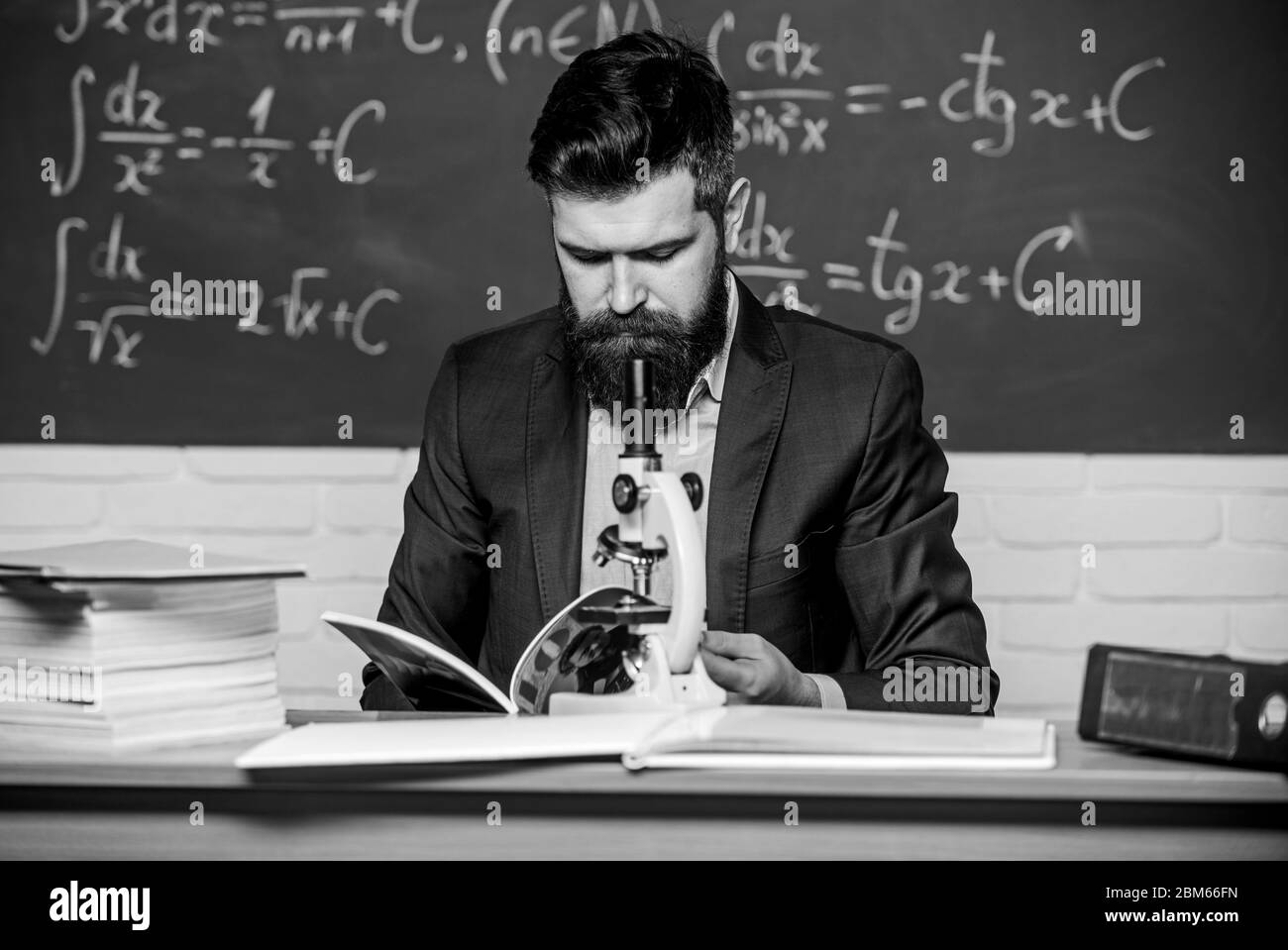 Scientist with microscope chalkboard background. On way to success ...