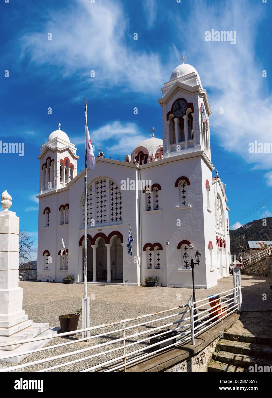 Church of Holy Cross with blue sky and white clouds in Pedoulas village ...