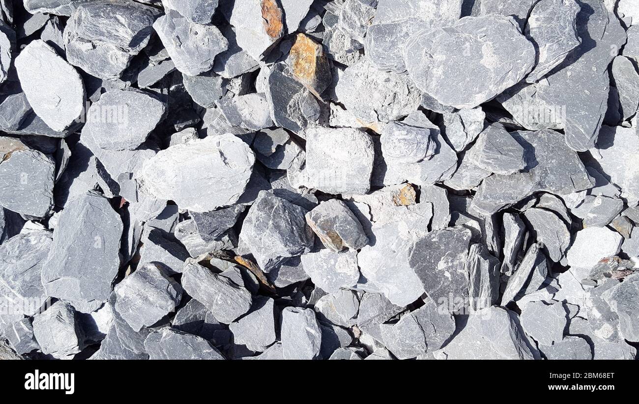 grey Colorful background of different sized rocks Stock Photo - Alamy