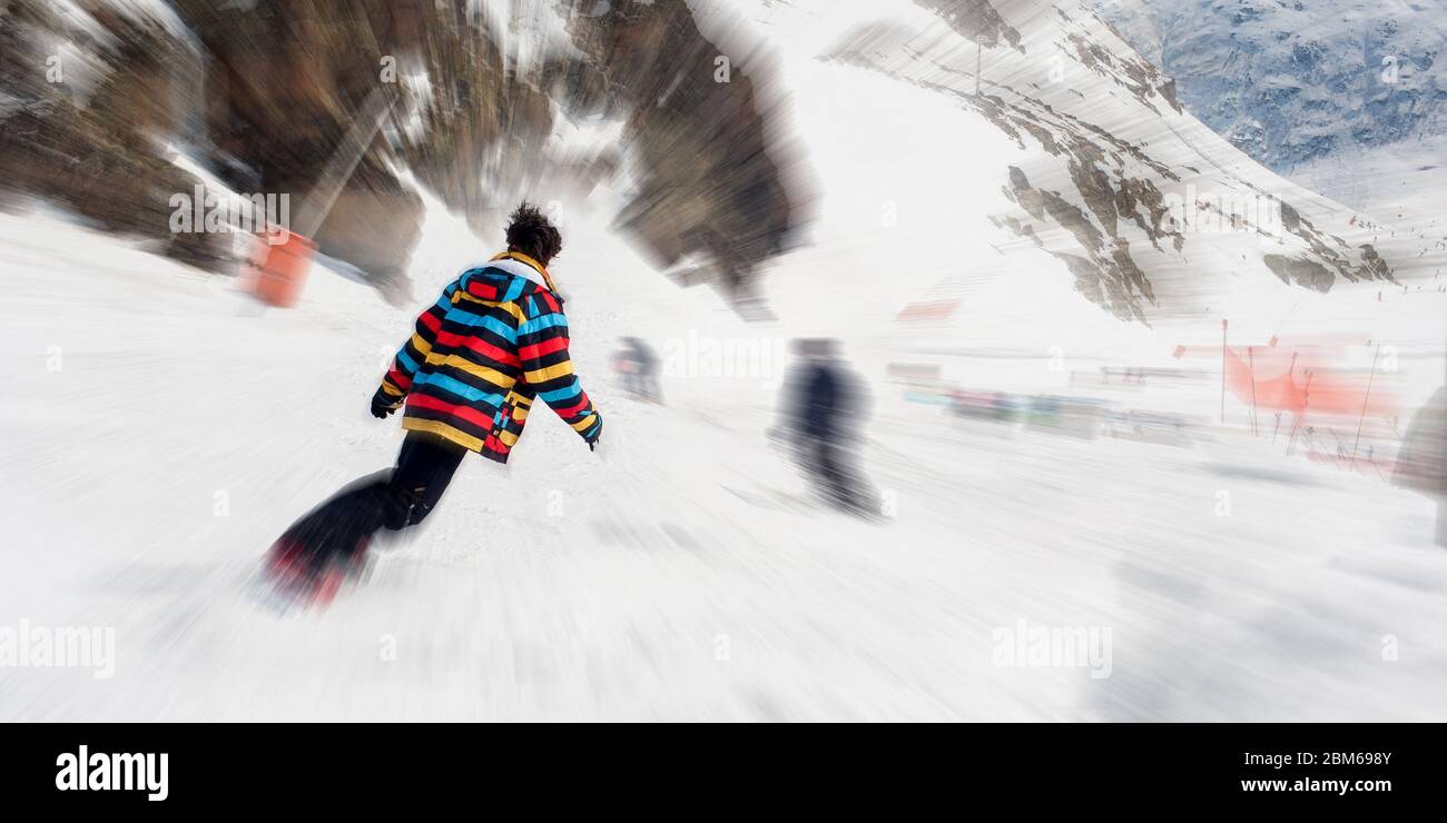 Speed feeling. Fast motion effect. Snowboarder rides his board among ...