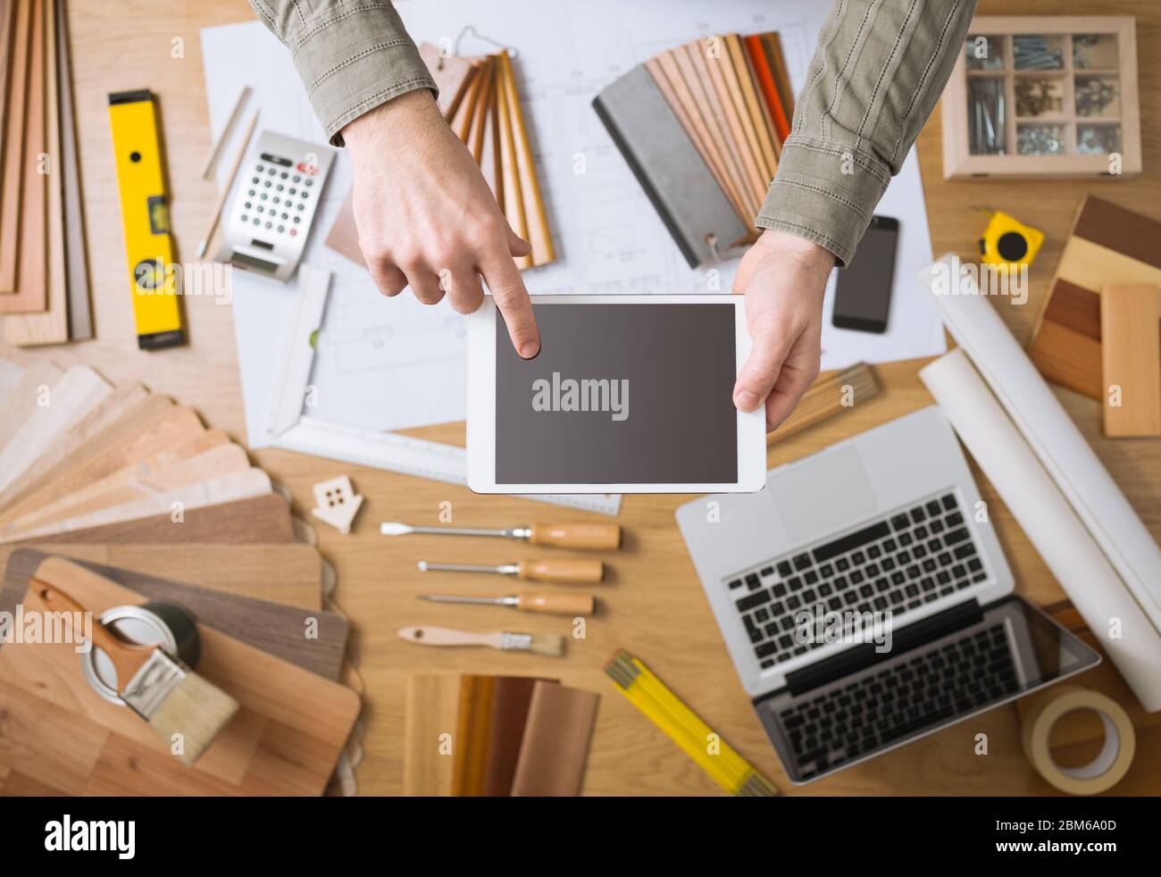 Professional interior designer and architect hands close up holding and ...